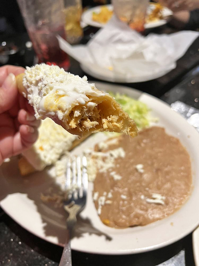 Flautas lined up like the world's most delicious cigar collection, ready to shatter with that first satisfying crunch before revealing their tender interior.