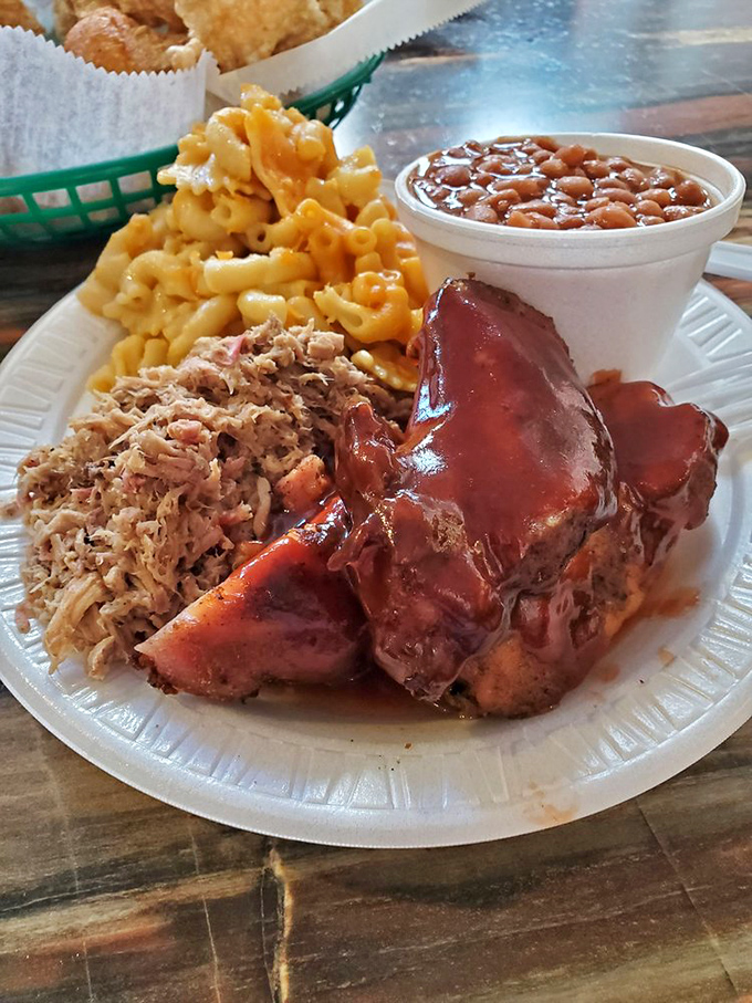A plate that hits all the right notes &ndash; tangy pork, creamy mac and cheese, savory beans, and those hush puppies that disappear too quickly.