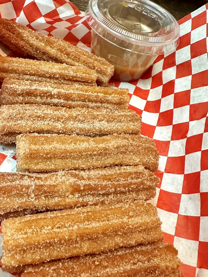 Churros lined up like delicious soldiers in a sugar-cinnamon battalion, ready to march straight into your heart via your taste buds.
