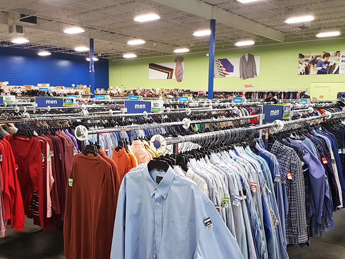 The men's department stretches like a sea of potential makeovers—button-downs, polos, and tees organized with military precision.