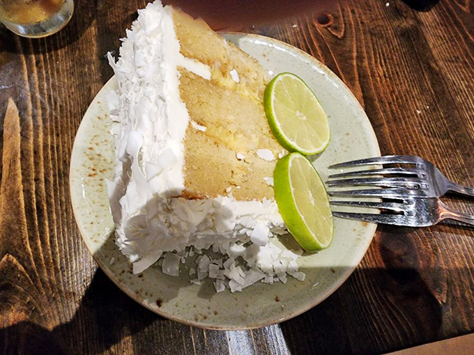 Coconut lime cake that makes you wonder why chocolate gets all the dessert glory—those lime slices aren't garnish, they're exclamation points.
