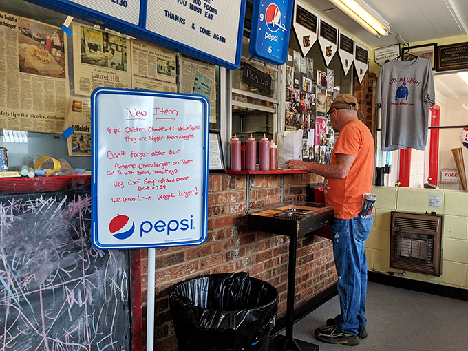The wall behind the counter tells stories decades in the making &ndash; newspaper clippings and local memorabilia create a community museum.