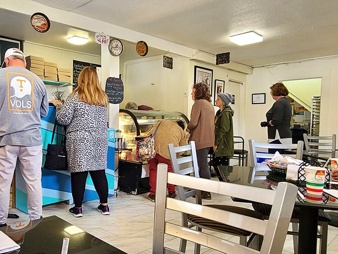 Regulars and first-timers alike gather around checkered tablecloths, participating in the timeless ritual of community through food.