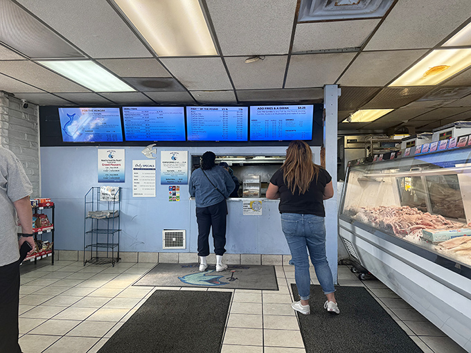 The universal language of anticipation: customers waiting for their ticket to seafood paradise.