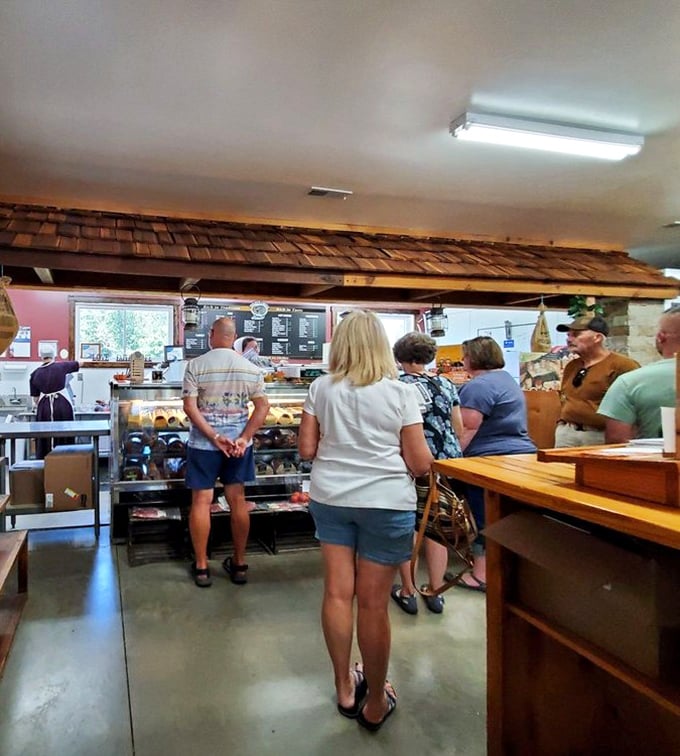 The bakery counter pilgrimage: where patience is rewarded with warm, handcrafted pastries. No app can replace this delicious analog experience.