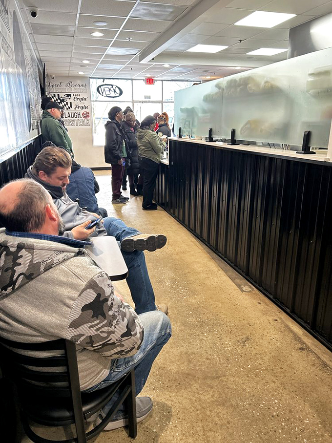 The line forms for a reason. These patient pilgrims know that greatness awaits at the counter ahead.