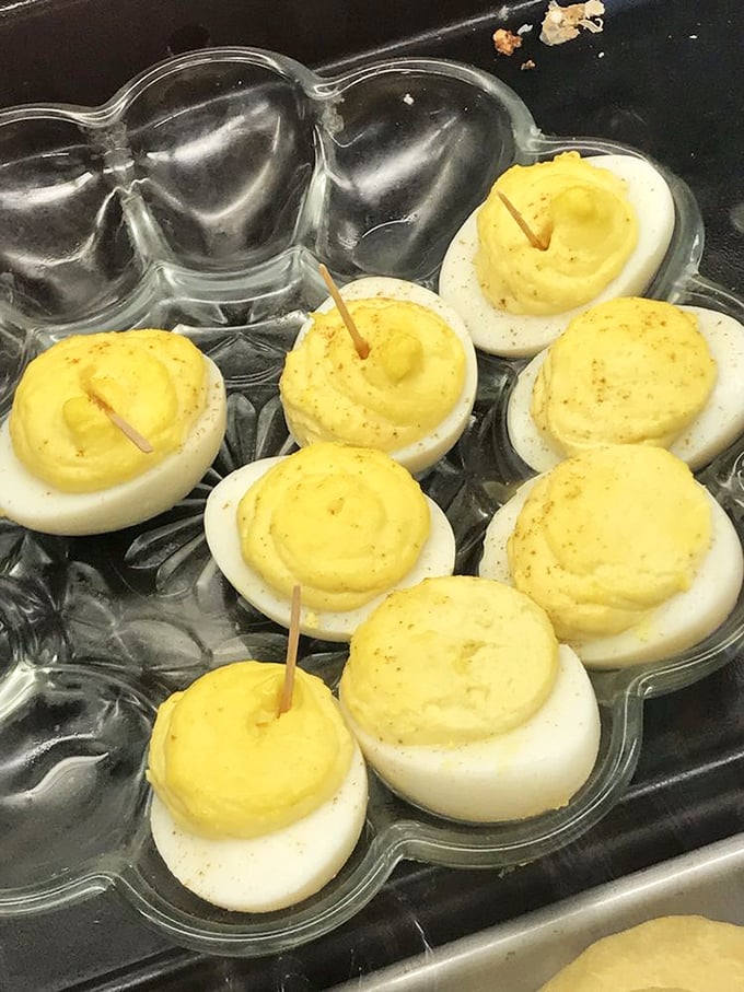 Deviled eggs that would make angels jealous. These golden treasures prove sometimes the simplest foods deliver the most satisfaction.