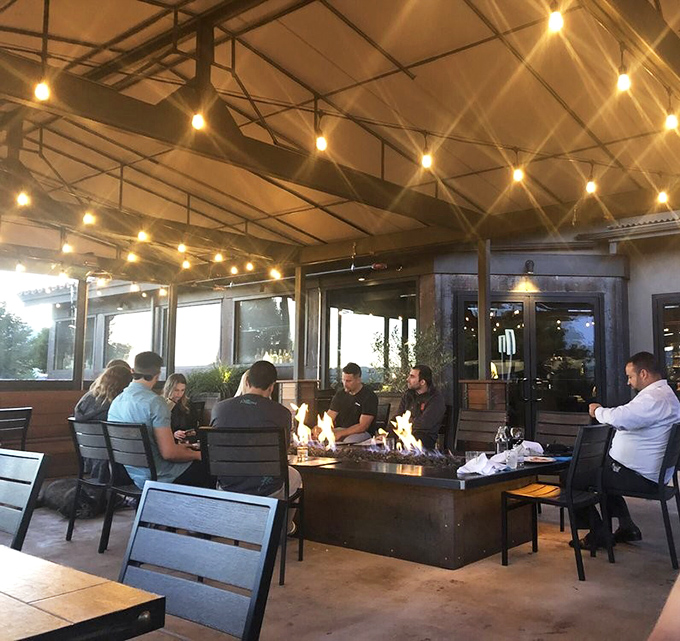 The outdoor patio's string lights and fire feature transform evening dining into a magical experience&mdash;like dinner and a show, where the flames dance for you.