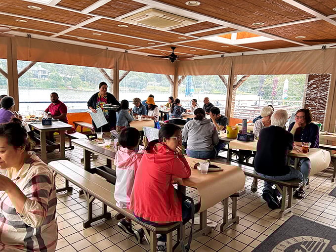 Where strangers become friends over shared crab-picking techniques. Nothing builds community quite like collectively destroying shellfish. 
