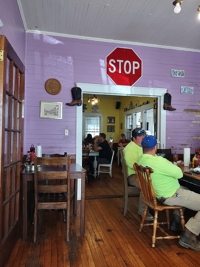 Under the watchful eye of a vintage stop sign, diners engage in the sacred ritual of serious eating&mdash;conversation optional.