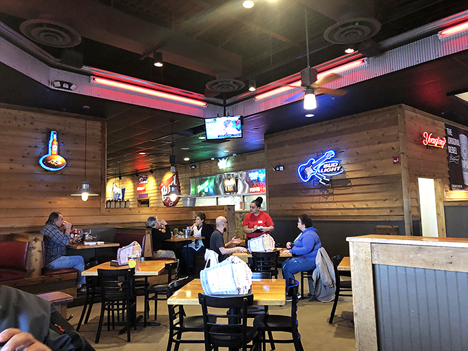 Where neon beer signs meet wooden walls&mdash;a modern saloon where conversations flow as freely as the barbecue sauce.