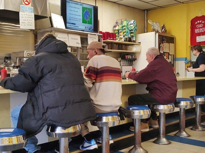 The lunch counter democracy&mdash;where doctors sit next to plumbers, and everyone speaks the universal language of "pass the ketchup." 