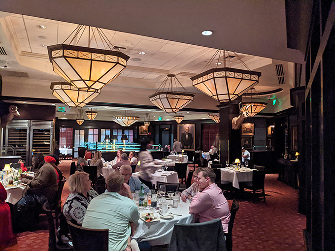 Where culinary magic happens &ndash; the art-deco chandeliers casting a glow that makes everyone look like they've just closed a successful business deal.