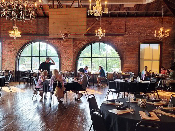 Natural light streams through arched windows, illuminating diners who've made the wise decision to prioritize exceptional steak over ordinary lunch.
