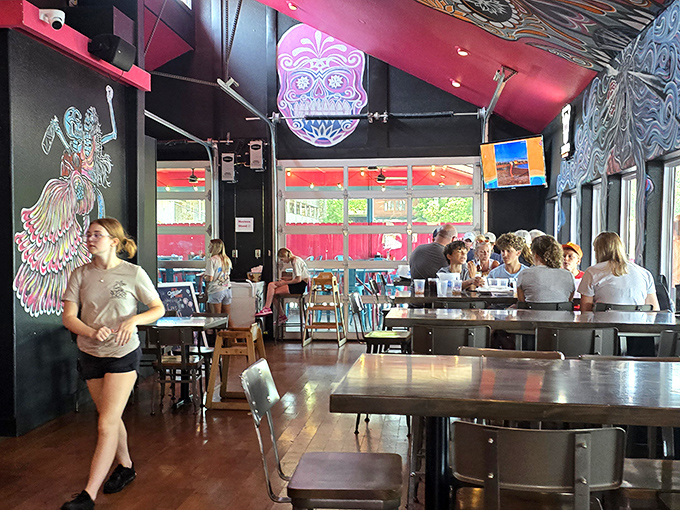 Where good food meets good company &ndash; the black ceiling makes the vibrant artwork pop like fireworks on a summer night. 