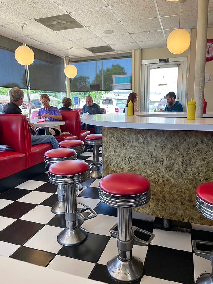 Generations gather at the altar of good food, proving that the best family traditions often involve melted cheese and friendly conversation.