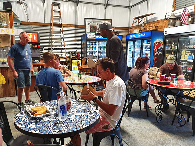 Community happens around these tables, where strangers become friends over sandwiches that make conversation pause mid-bite for that universal "mmm" moment.