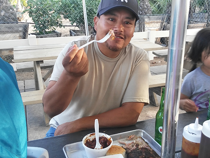 The universal expression of barbecue bliss. Nothing says "I've made the right life choices" quite like that first bite of perfectly smoked meat.