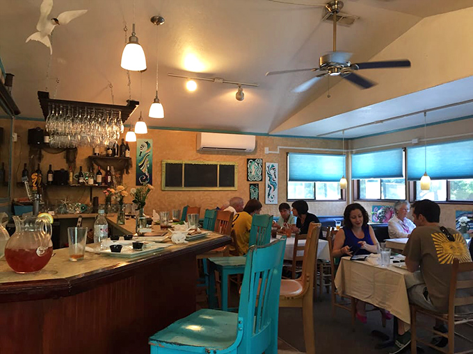 Where vacation memories are made between bites, and the blue chairs match the coastal vibe perfectly.