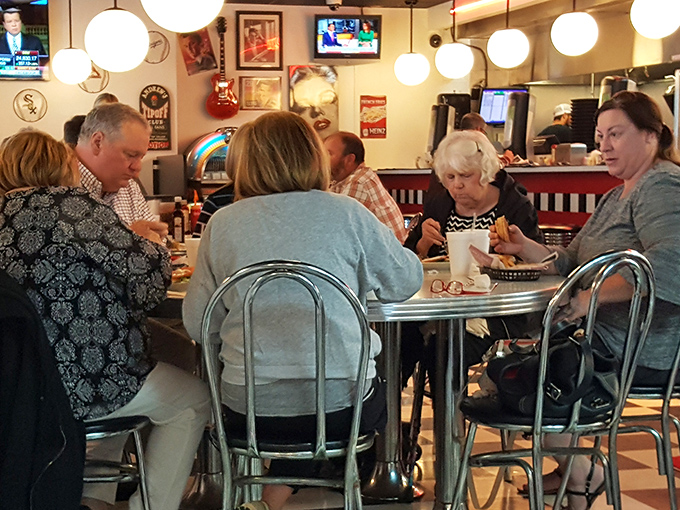 Regulars gather around chrome-trimmed tables, participating in that timeless American ritual: bonding over exceptional food.