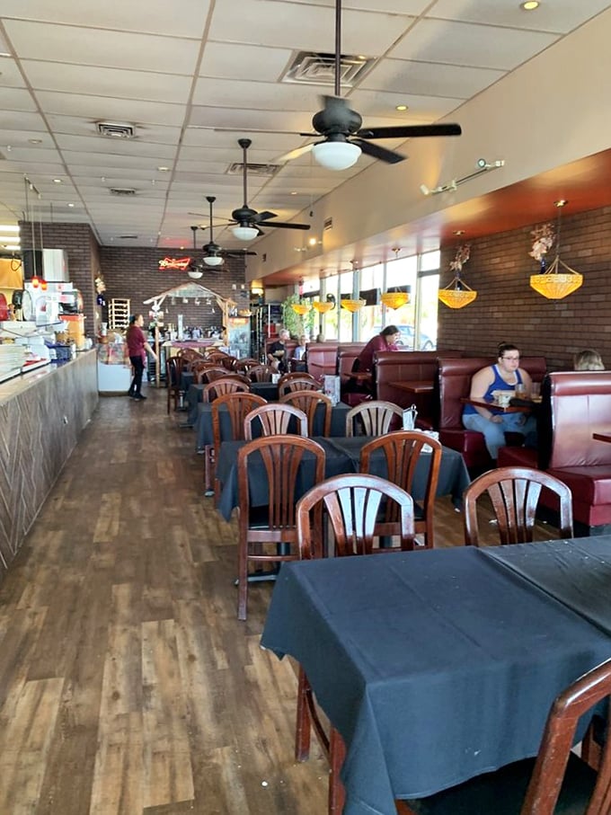 The restaurant's layout invites both intimate conversations and people-watching&mdash;notice how even empty tables seem to be waiting expectantly for their next story.