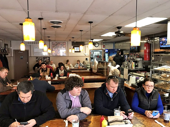 The morning crowd at Hamburger Inn&mdash;where strangers become neighbors over coffee and everyone's watching the grill like it's the final episode of their favorite show.