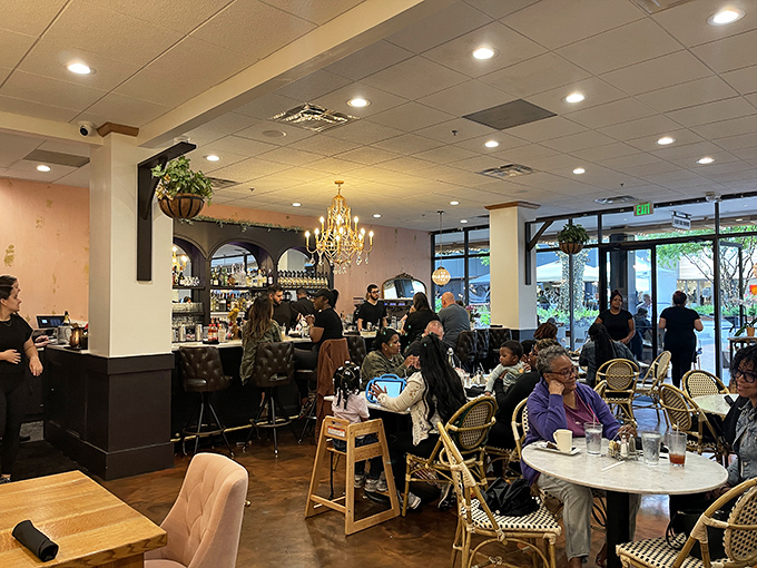 A bustling Sunday scene where coffee cups and conversation flow with equal enthusiasm – the universal church of brunch devotees.