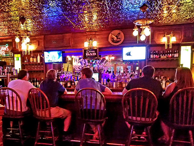 The bar scene: where locals gather, sports play silently overhead, and cocktail conversations flow as smoothly as the drinks themselves.