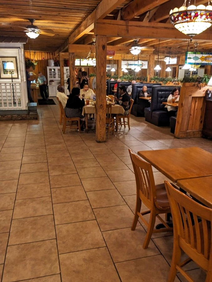 The gentle hum of satisfied diners under wooden beams creates that perfect steakhouse symphony that no recording can capture.