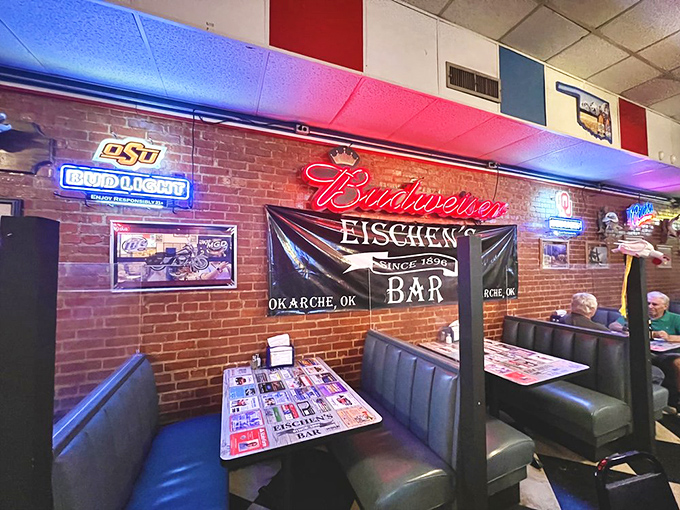Neon signs cast a warm glow over booths filled with regulars and first-timers alike. The atmosphere buzzes with anticipation of that famous chicken.