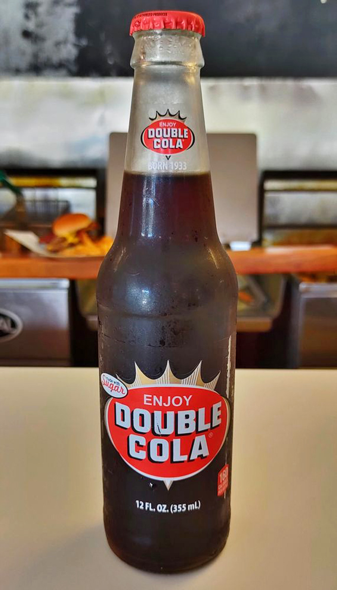The Double Cola pairs perfectly with Johnny's burgers. This regional soda favorite provides the fizzy counterpoint to all that savory goodness.