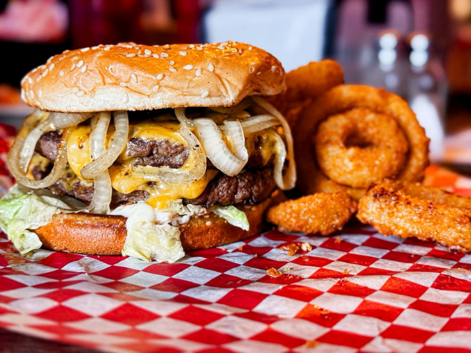 This isn't just a burger&mdash;it's an architectural marvel of beef, cheese, and grilled onions that requires both hands and a strategy.