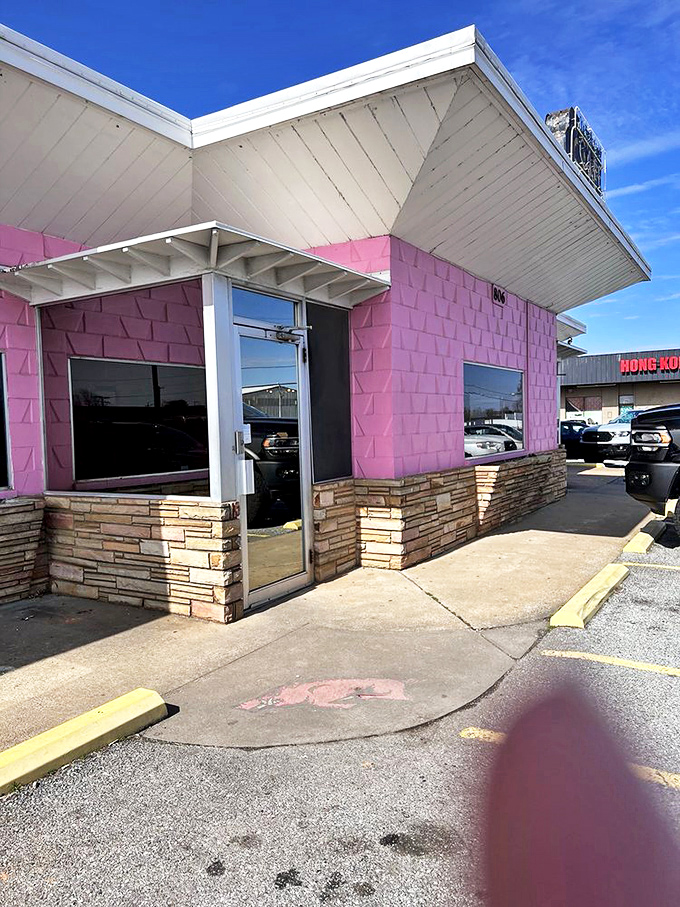 The entrance to paradise is painted pink and trimmed with stone. Who knew heaven had such distinctive architectural preferences?