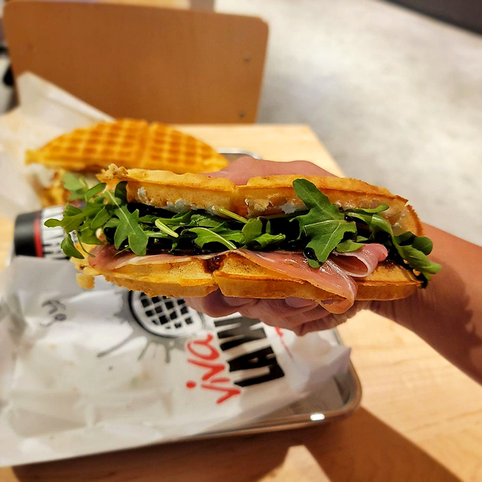 Layers of flavor between golden-brown waffle walls. This isn't just a sandwich—it's architecture you can eat.