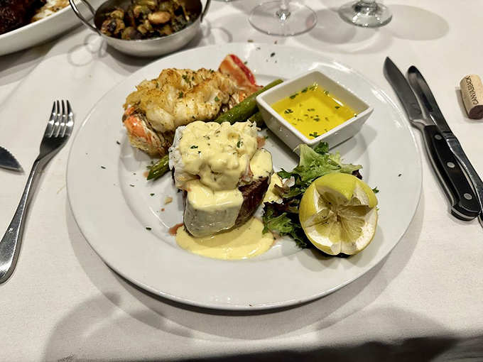 Surf meets turf in this elegant plate featuring lobster tail and filet. Ocean and pasture having a delicious summit meeting.