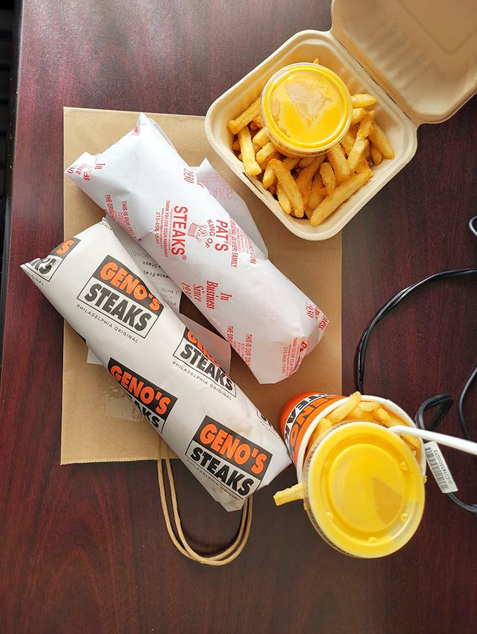The ultimate cheesesteak companion! Golden fries from Pat's come in their own branded cup&mdash;because even the sides deserve the royal treatment.