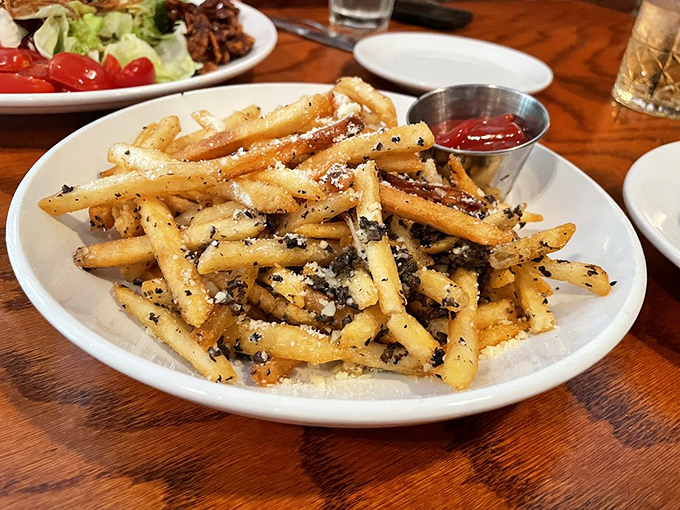 Album covers displayed like the rock and roll royalty they are. The Beatles and Miles Davis still commanding attention in the streaming age.