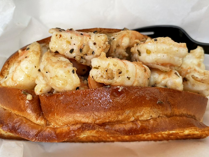 The garlic shrimp roll&mdash;where buttery, garlicky shrimp find their perfect home in a toasted bun. It's like a seafood hug for your taste buds.