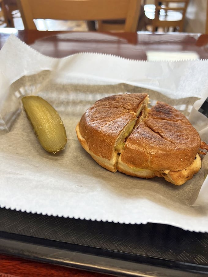 The perfect grilled sandwich doesn't exi&mdash; Oh wait, here it is. Golden bread, melty cheese, and a pickle standing guard against hunger.