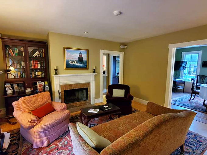 Living rooms should tell stories, not just hold furniture. This one whispers tales of Chesapeake Bay adventures through maritime art and warm woods.