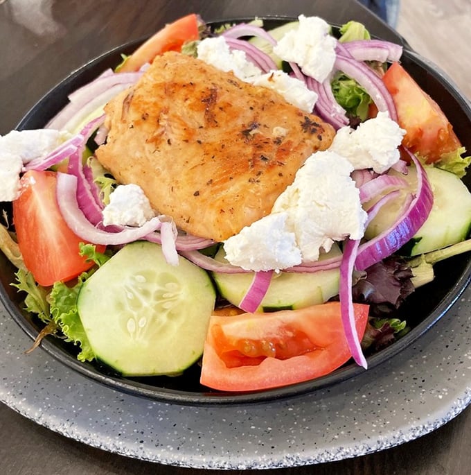 A salad that doesn't apologize for being healthy. That perfectly seared salmon is the protein protagonist in this nutritious narrative.