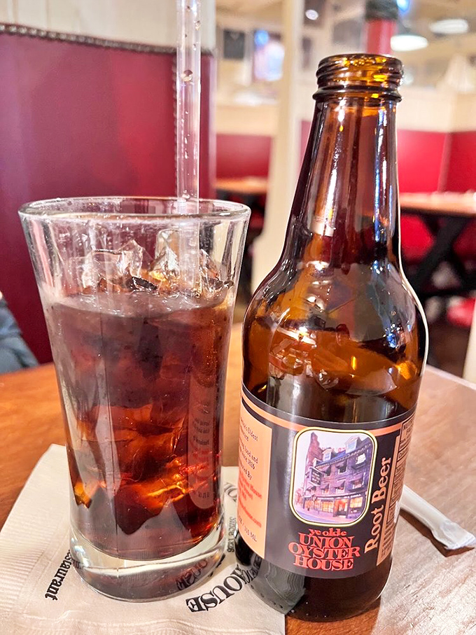 House-made root beer served alongside the menu &ndash; proof that even the beverages at this historic establishment deserve their own moment in the spotlight.