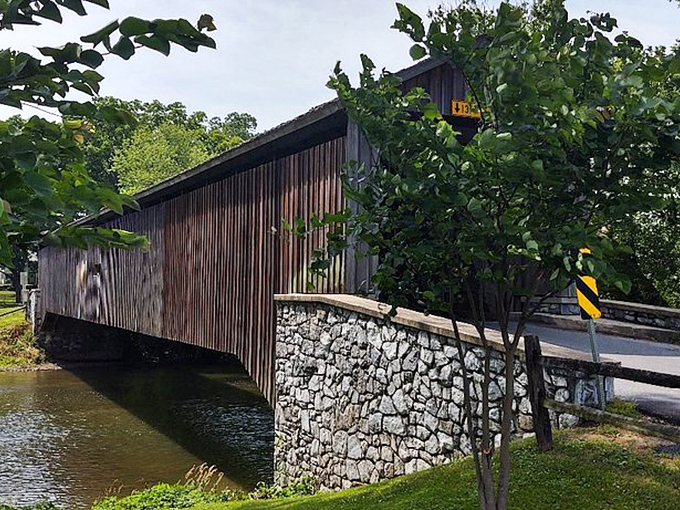 This wrought iron gate doesn't just say "welcome" &ndash; it whispers "the garden party of your dreams is just beyond these bars." 