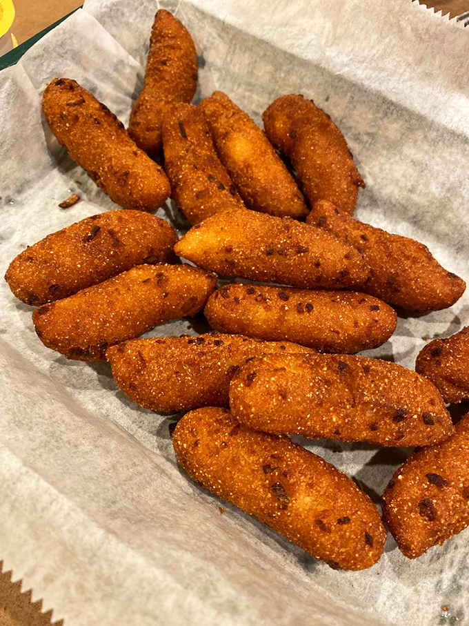 Hush puppies so perfectly golden they look like they're blushing from all the compliments. Crispy outside, tender inside&mdash;the ideal seafood sidekick.