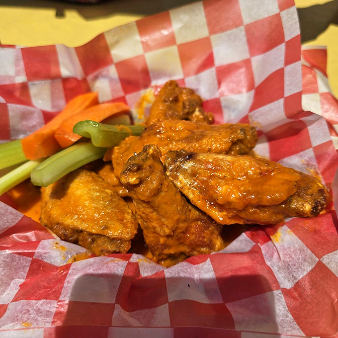 These wings aren't just spicy&mdash;they're having a full-blown flavor carnival, complete with cooling celery and carrot sidekicks for when things get too wild.