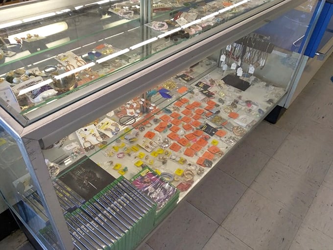 Jewelry case of dreams and schemes. Those orange-tagged treasures might be costume or crown jewels&mdash;the thrill is in the discovery.