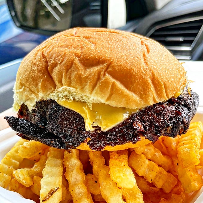A burger and fries eaten in your car: the modern American picnic. Those crispy edges are what burger dreams are made of.
