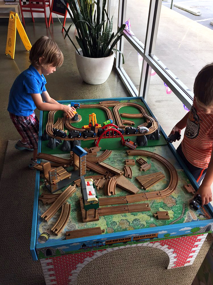The train table&mdash;where future engineers and food critics alike can play while parents enjoy a moment of peace and an actual hot meal.