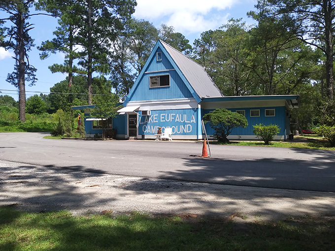 Lake Eufaula Campground's A-frame office has welcomed outdoor enthusiasts for decades, its weathered blue siding telling tales of countless fishing adventures.