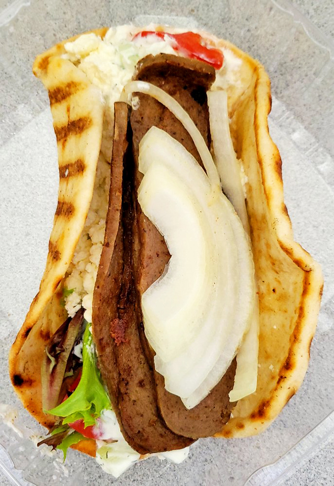 The lamb gyro presents itself with the confidence of something that knows exactly how delicious it is.